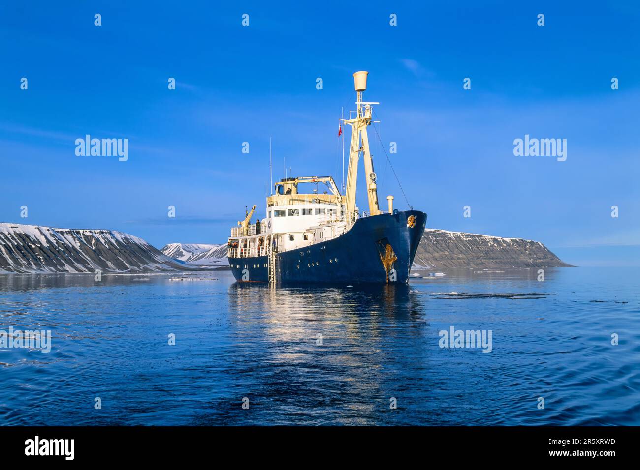 Passenger ship in a sea bay at Svalbard coast in the arctic, Svalbard ...