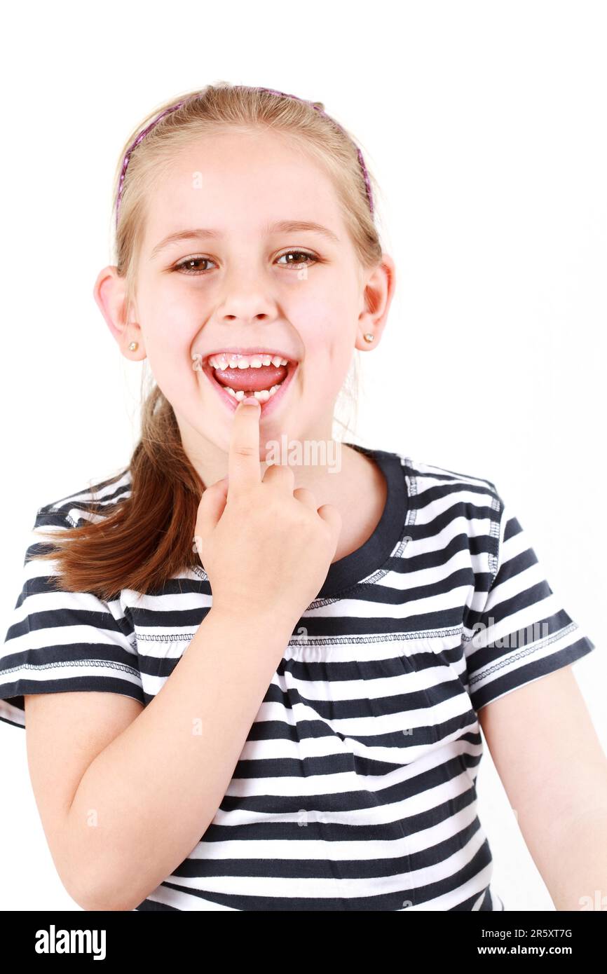 Happy girl with her first missing tooth Stock Photo - Alamy