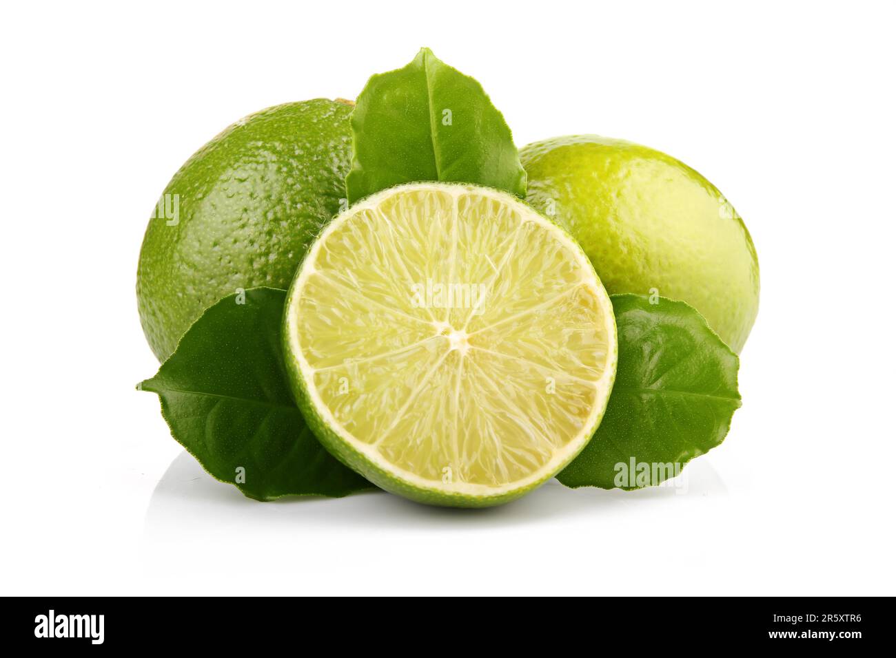 Sliced lemon on green background Cut Out Stock Images & Pictures - Alamy