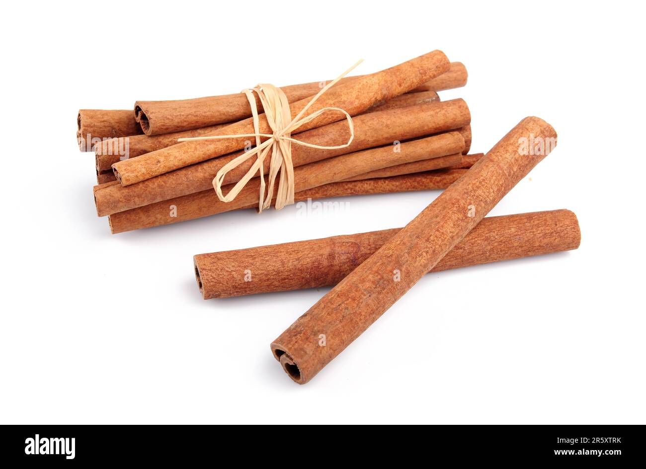 Bunch of cinnamon sticks isolated on white background Stock Photo - Alamy