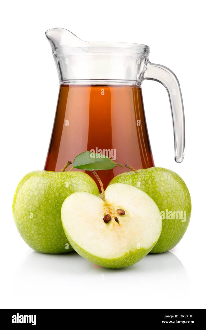 Jug and glass of green apple juice with fruit isolated on white ...