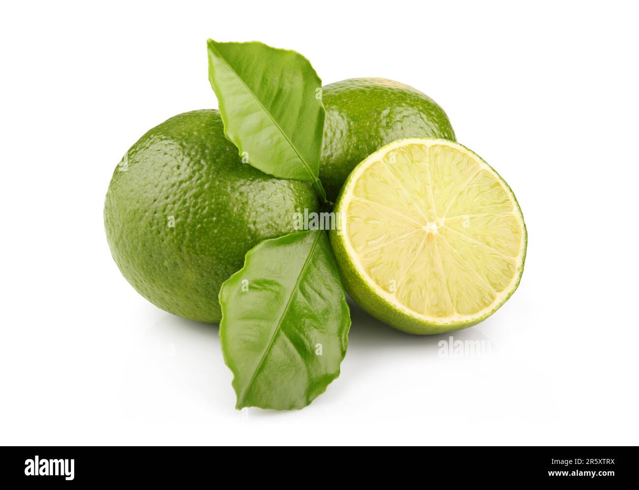 Ripe lime fruits with green leaves isolated on white background Stock ...