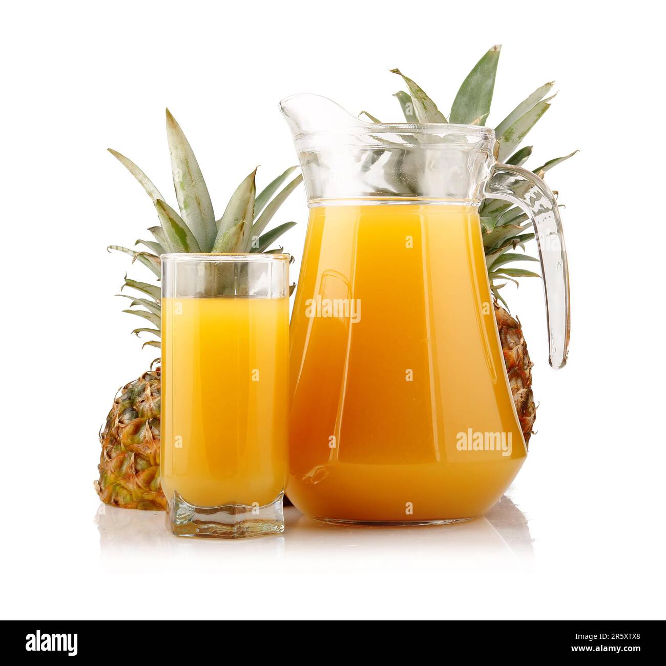 Jug and glass of pineapple juice with fruits isolated on white background Stock Photo - Alamy