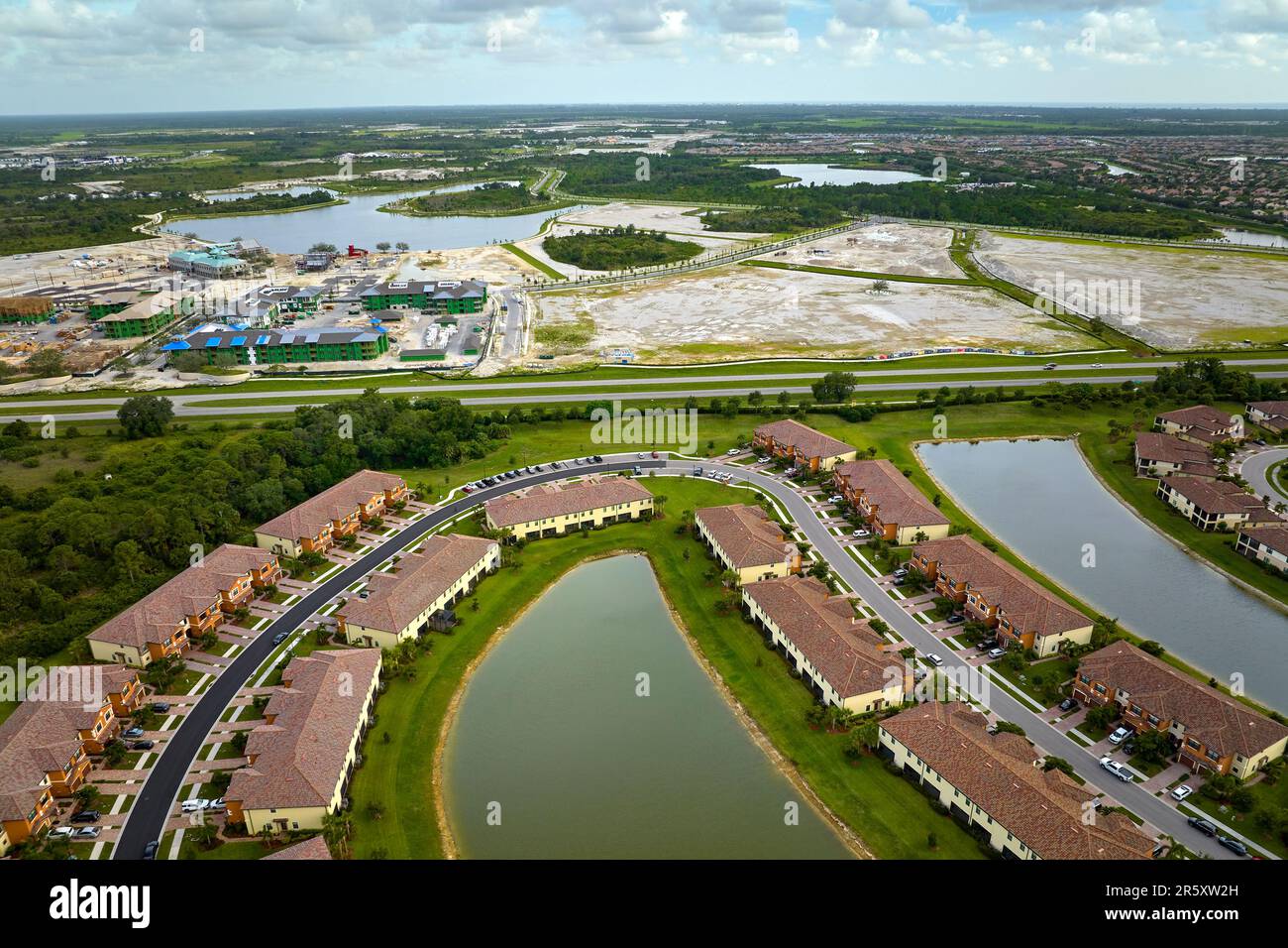Aerial view of real estate development with tightly located family ...