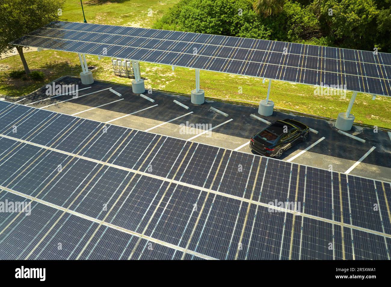 Aerial view of solar panels installed as shade roof over parking lot ...
