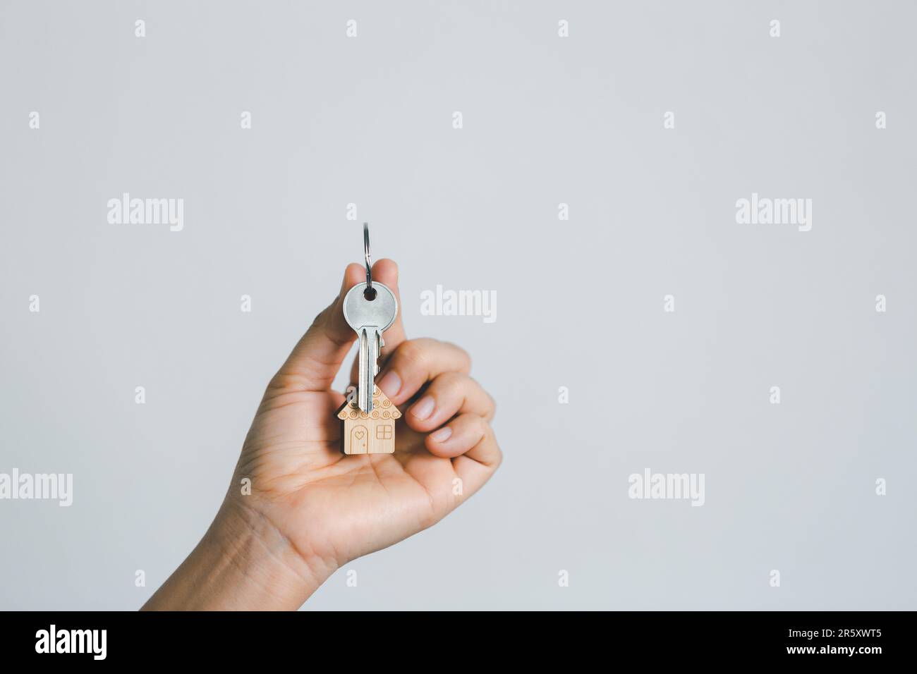 key to your own home in the palm of the girl and a wooden for real ...