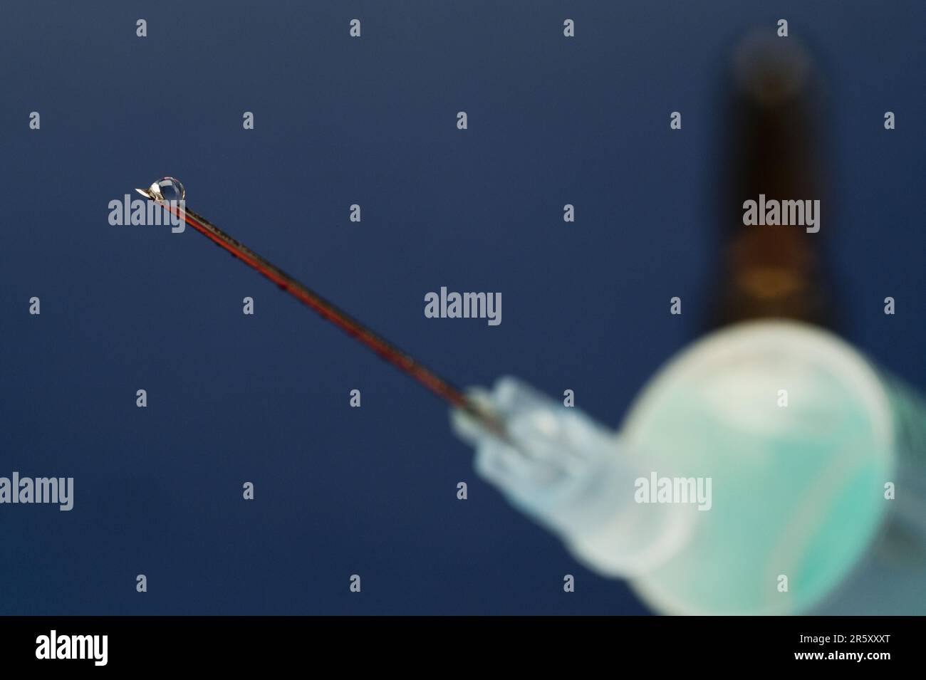 Drop at tip of syringe Stock Photo - Alamy