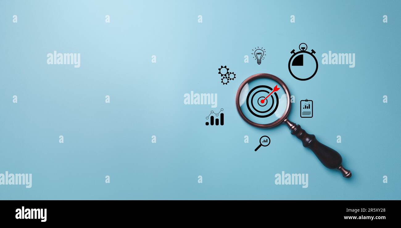 Target board inside vintage magnifying glass for focus business ...