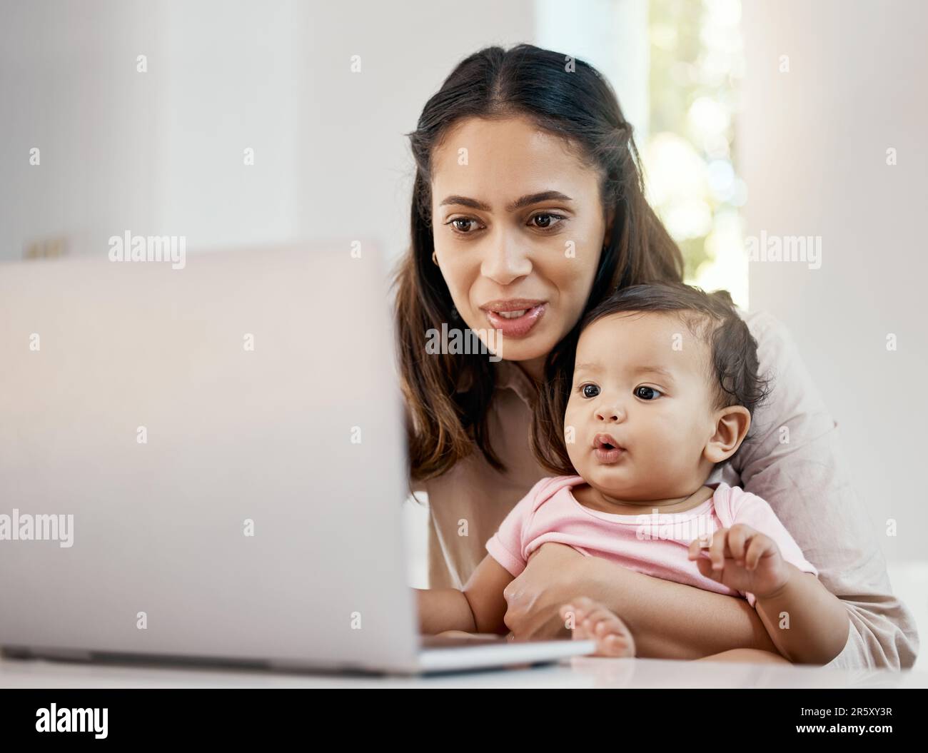 Smile, remote work and mother with baby and laptop, happy freelancer ...