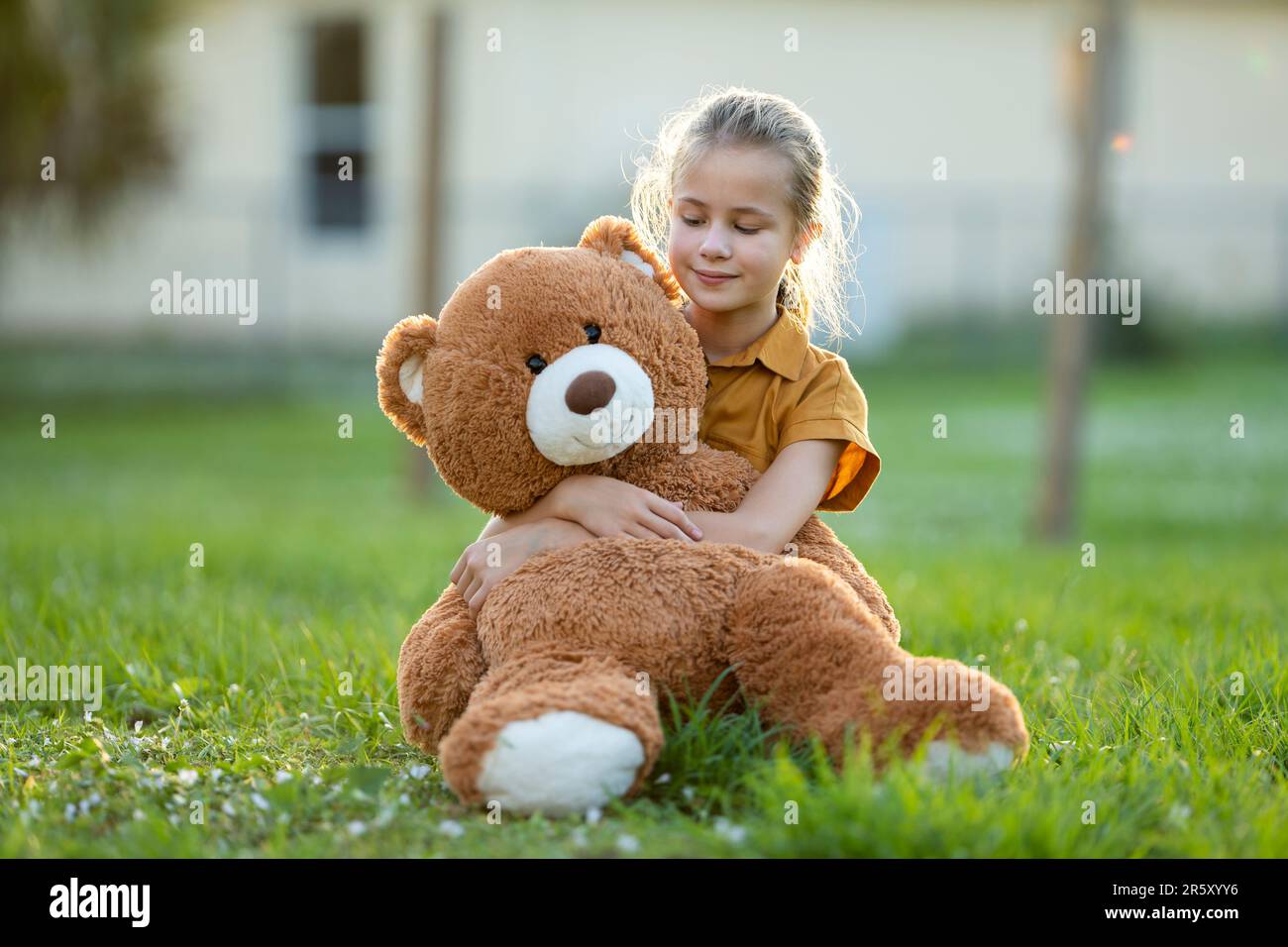 Cute Baby Girl Hugging Teddy Bear
