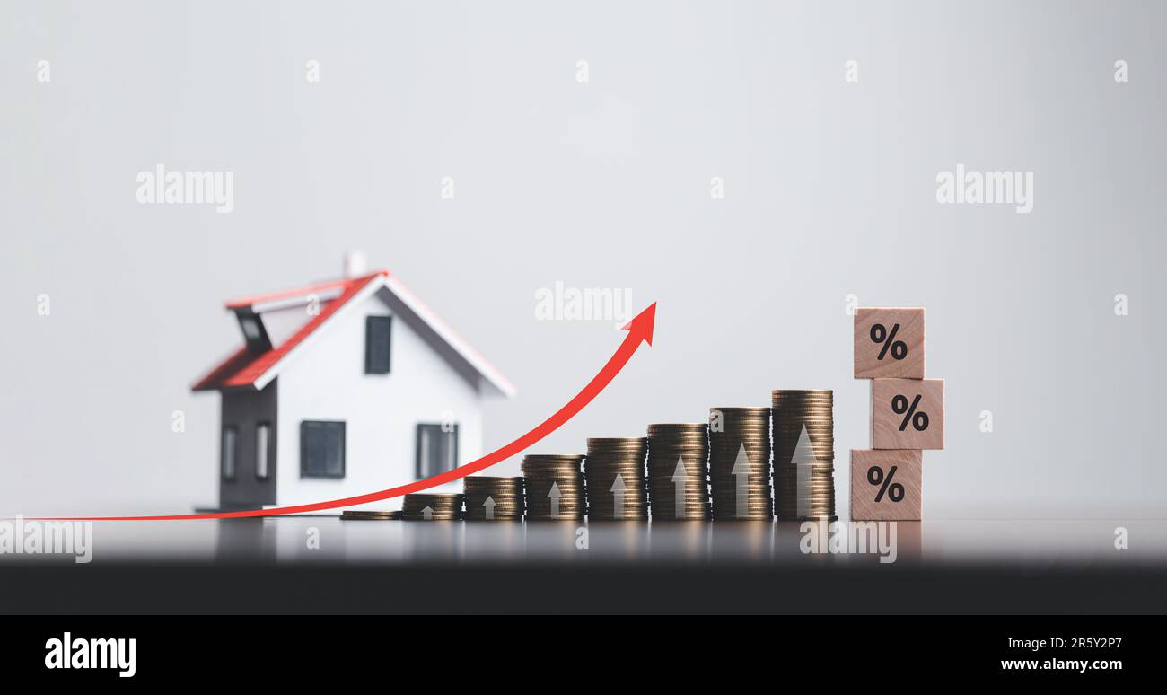 Stacks of coins and model house with percentage symbol for increasing ...