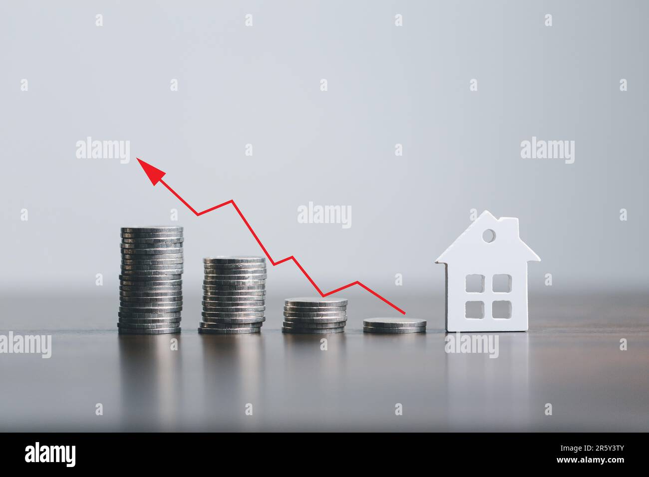 Real estate market, graph, up arrow. Mini house and a stack of coins ...