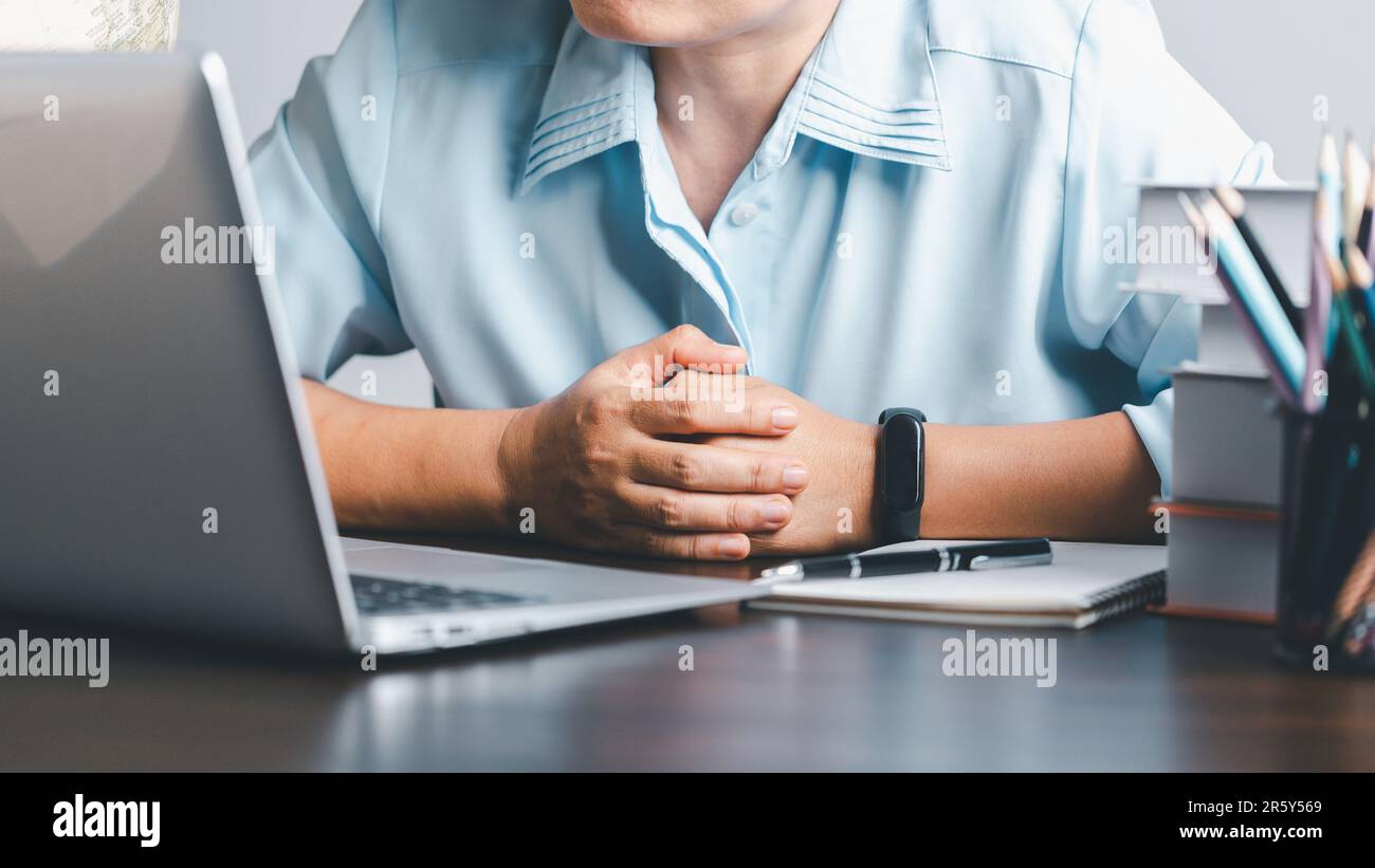 Female student study in the school library. She using laptop and ...