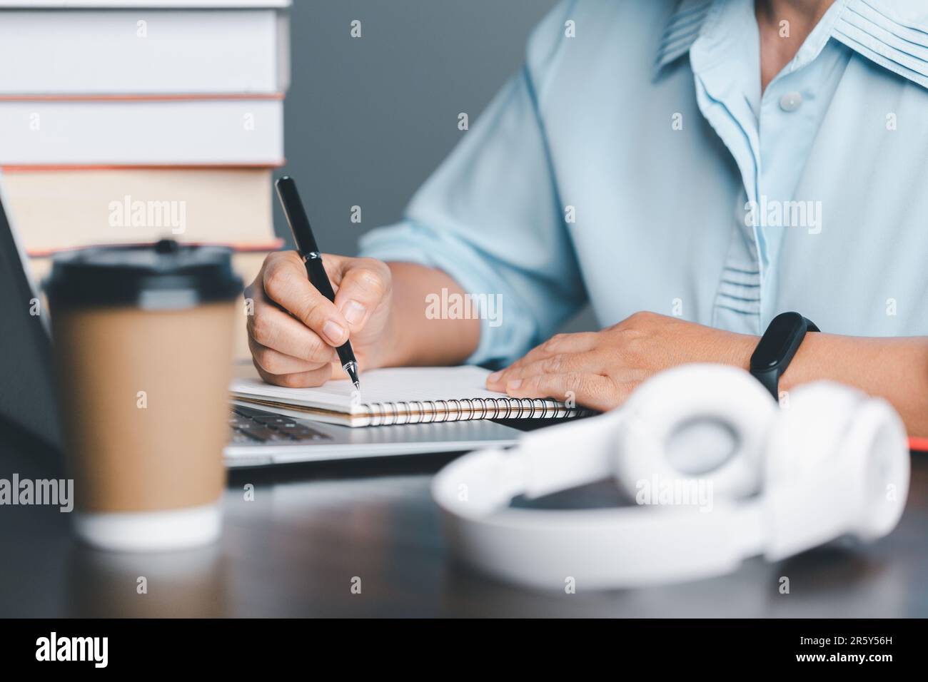 Education concept. Close up of female student make notes hand write in ...