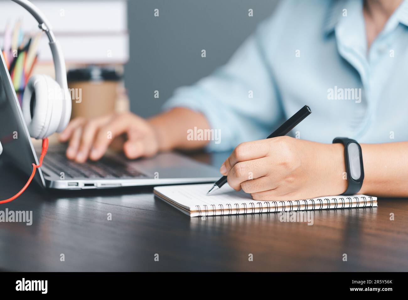 Education concept. Close up of female student make notes hand write in ...