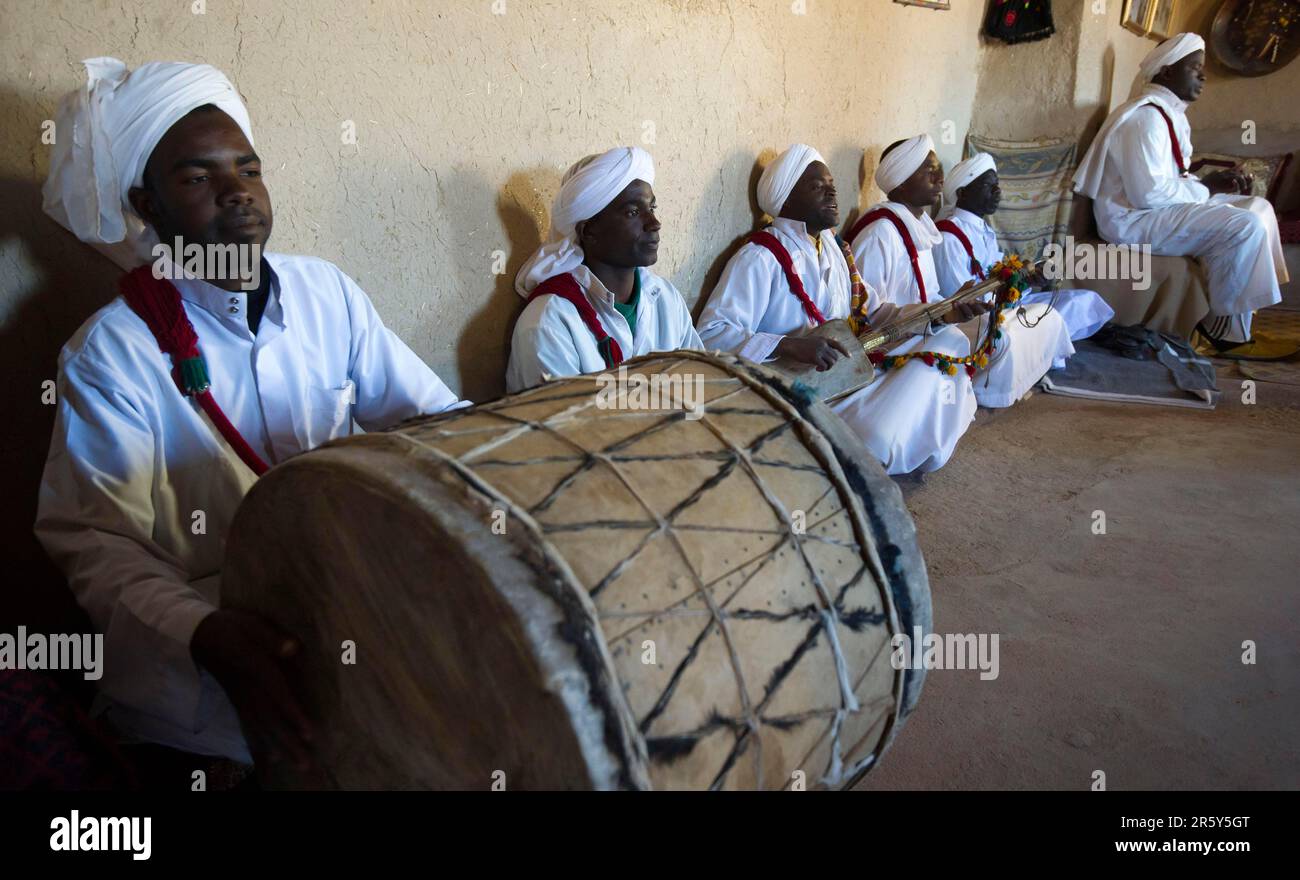 Morocco, traditional musicians with instruments, Pigeons du Sable group ...