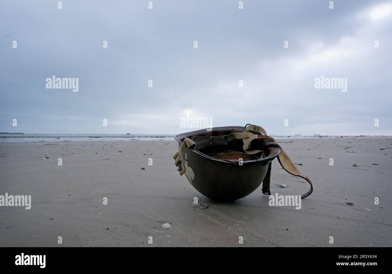A War Two helmet is placed on the beach in Arromanches-les-Bains ... A War Two helmet is placed on the beach in Arromanches-les-Bains ...
