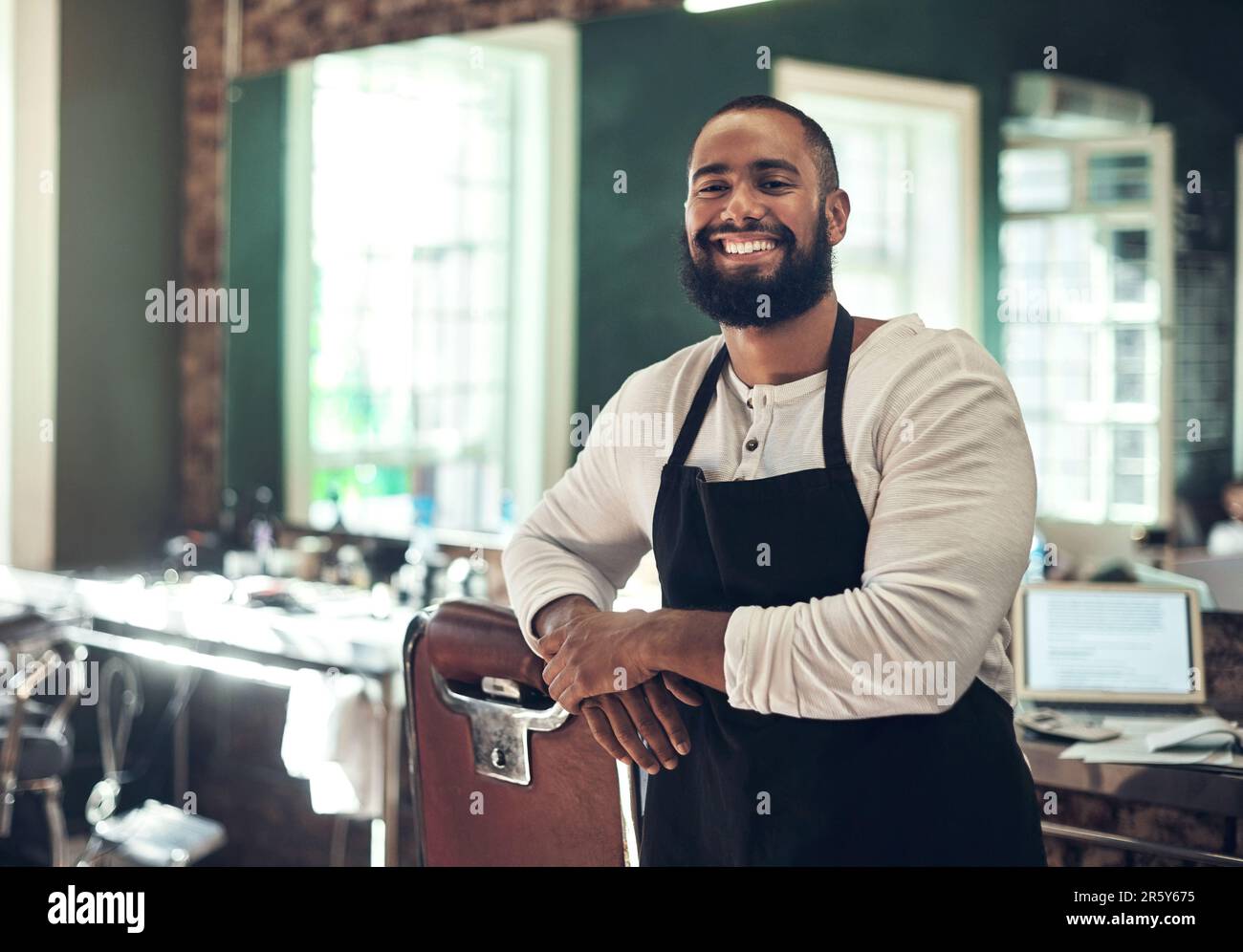 Barber shop employee, hair stylist and black man portrait of an ...