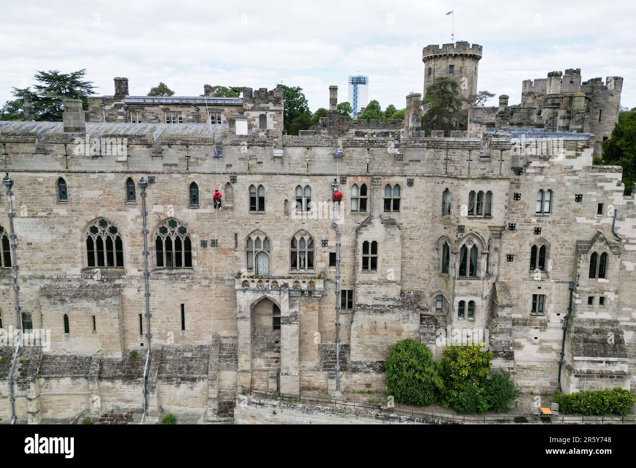 Cleaners abseil down the walls of Warwick Castle's south front, as they ...