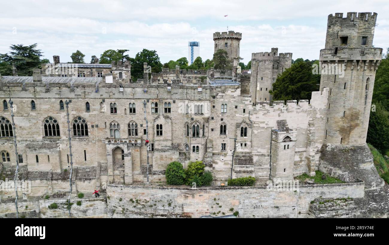 Cleaners abseil down the walls of Warwick Castle's south front, as they ...