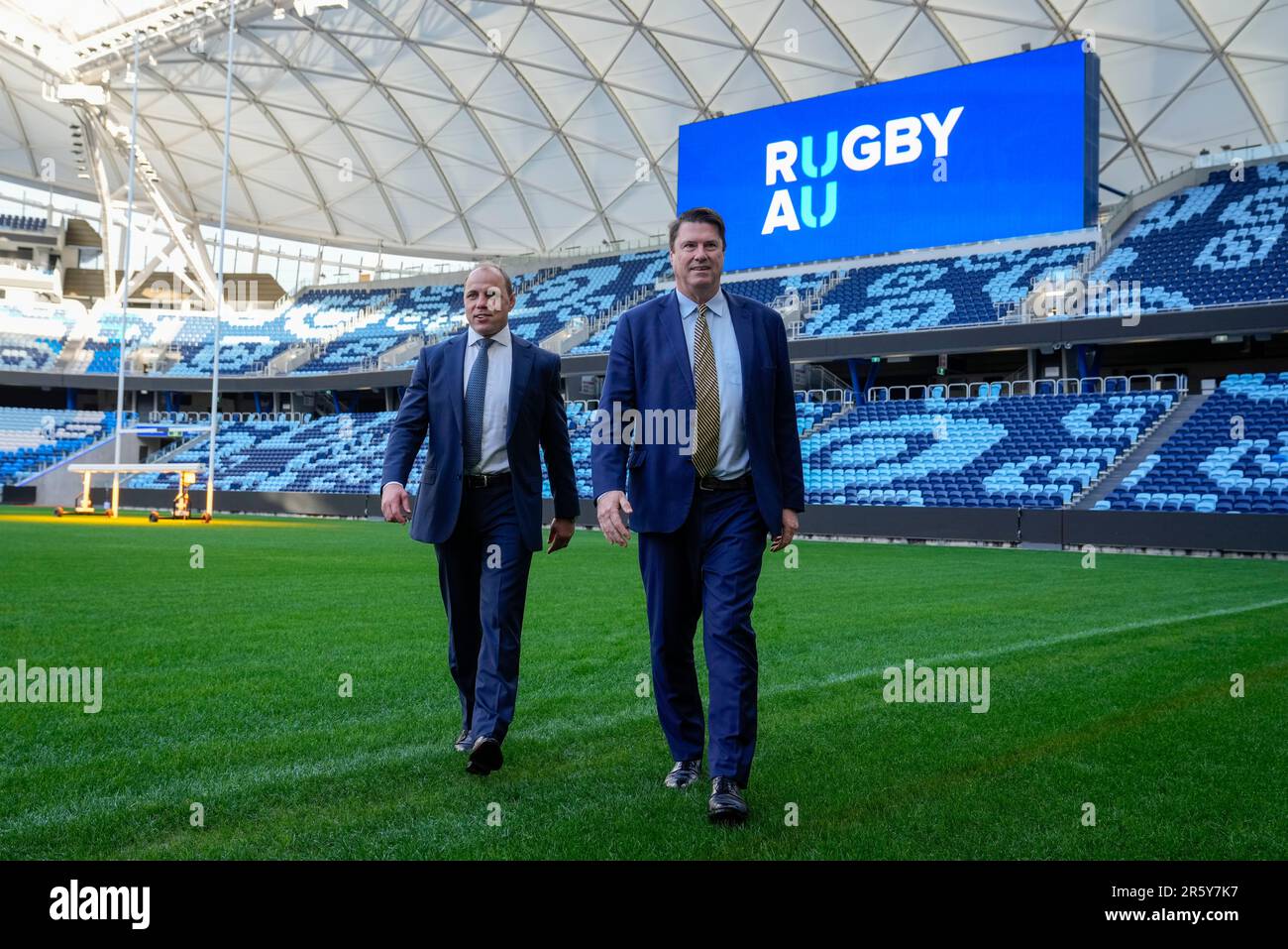Rugby Australia's new Chief Executive Phil Waugh, left, walks with ...