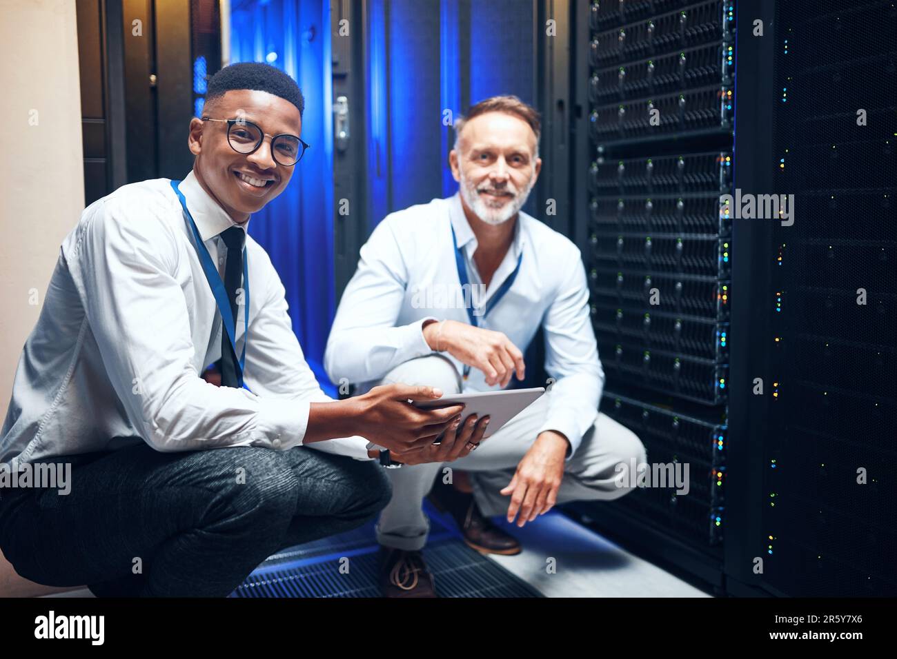 The tech gurus are on the case. Portrait of two technicians using a ...