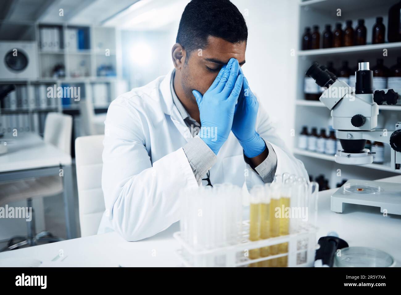 Laboratory, stress and man scientist with headache working in science ...