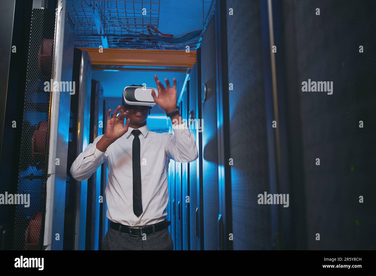 Coding in simulation is fun. a young IT specialist standing alone in ...