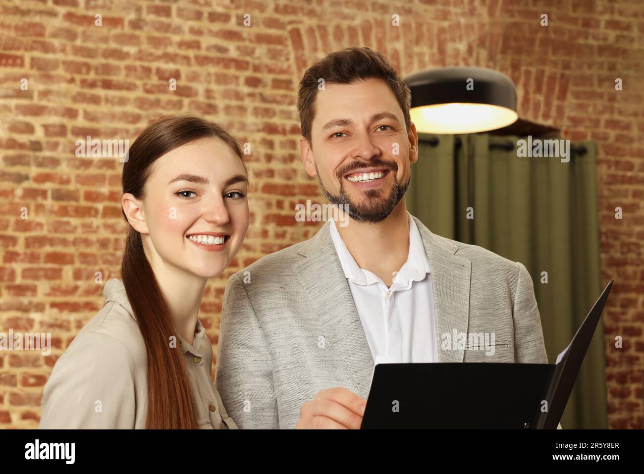 Portrait of happy employees in office. Team work Stock Photo - Alamy