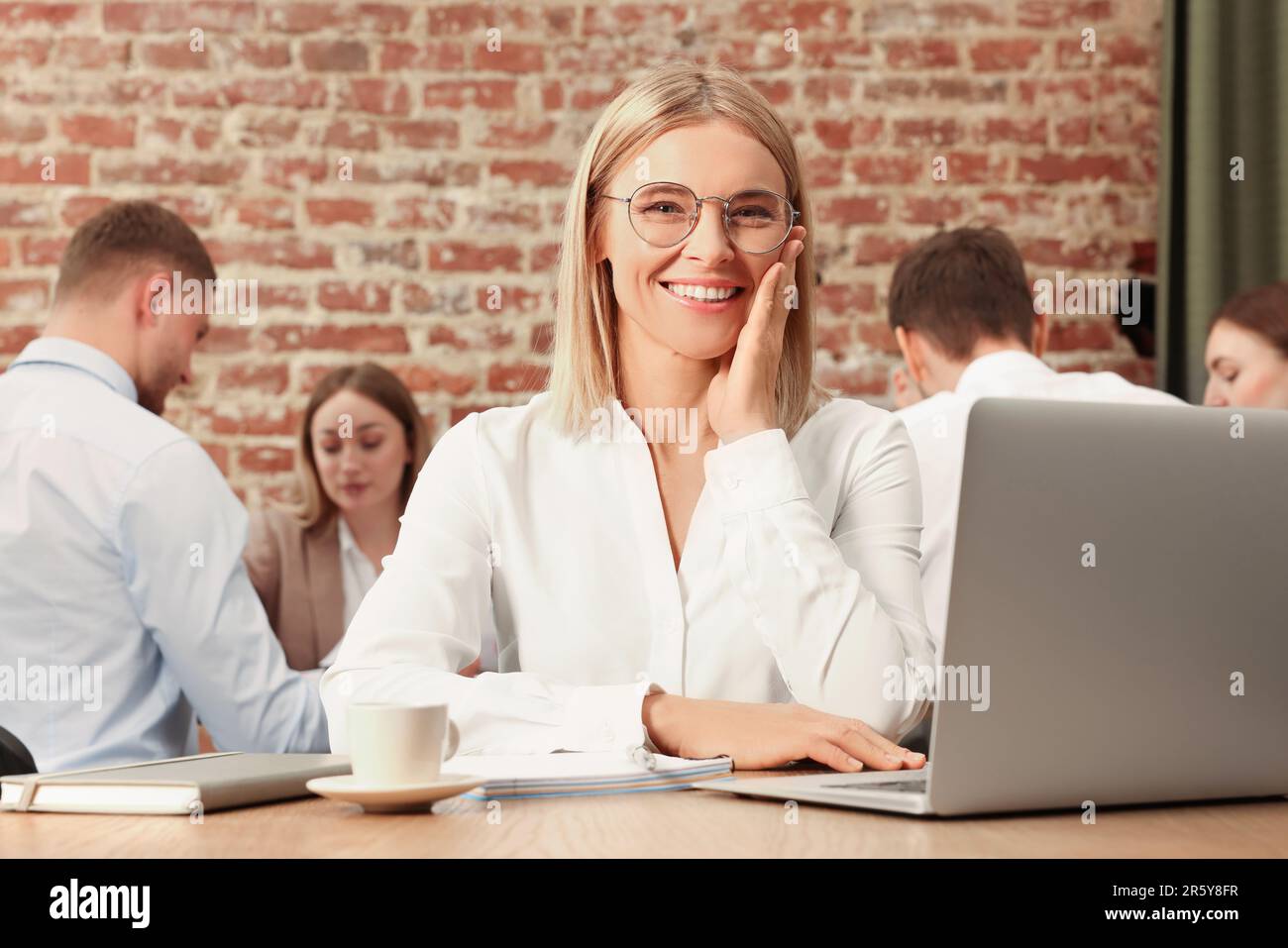 Businesswoman and her employees in office. Lady boss Stock Photo - Alamy