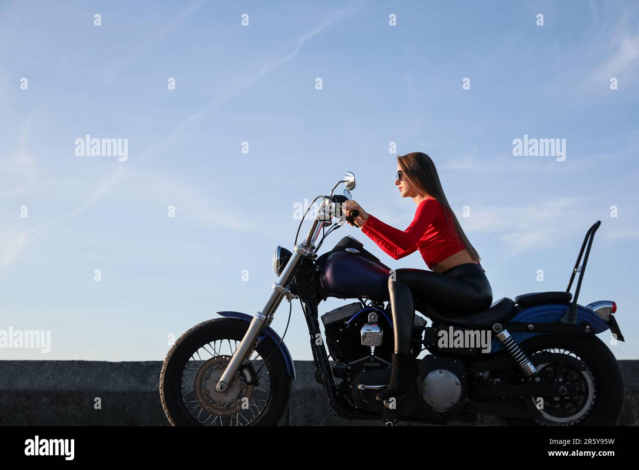 Beautiful young woman riding motorcycle hi-res stock photography and ...