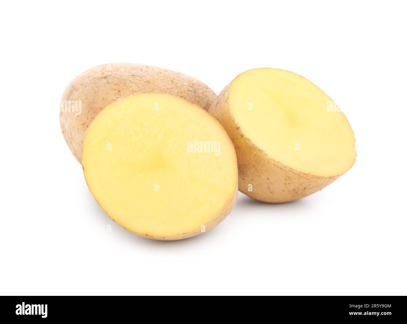 Whole and cut fresh potatoes on white background Stock Photo - Alamy