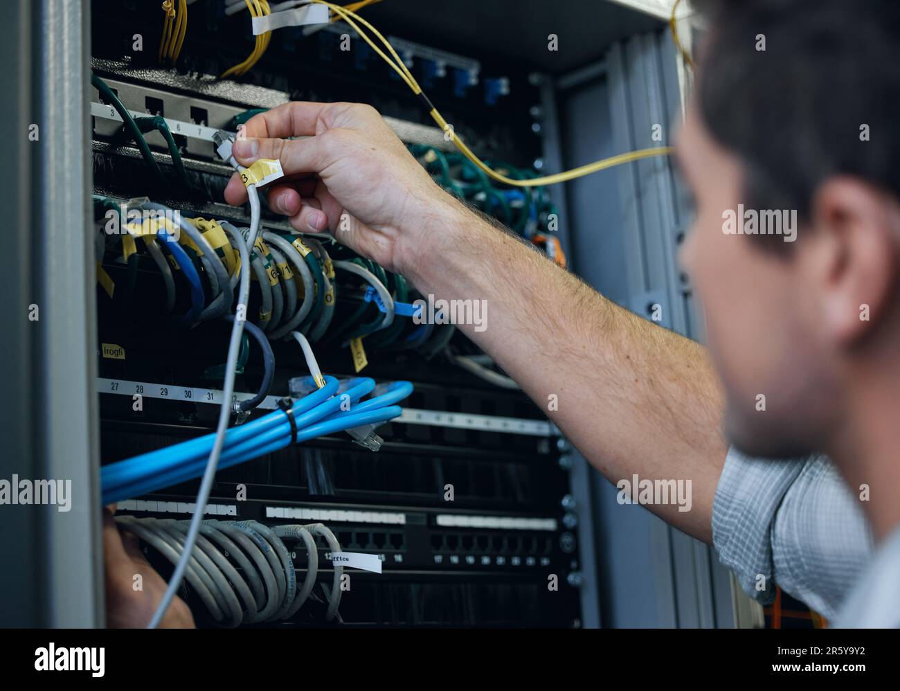 Server room, technician and hands of man with cable for programming ...