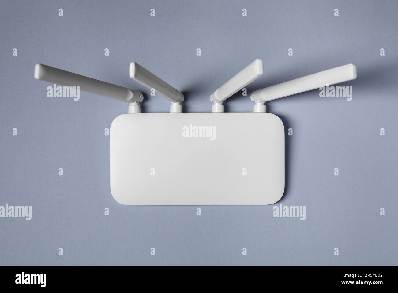New stylish Wi-Fi router on grey background, top view Stock Photo - Alamy