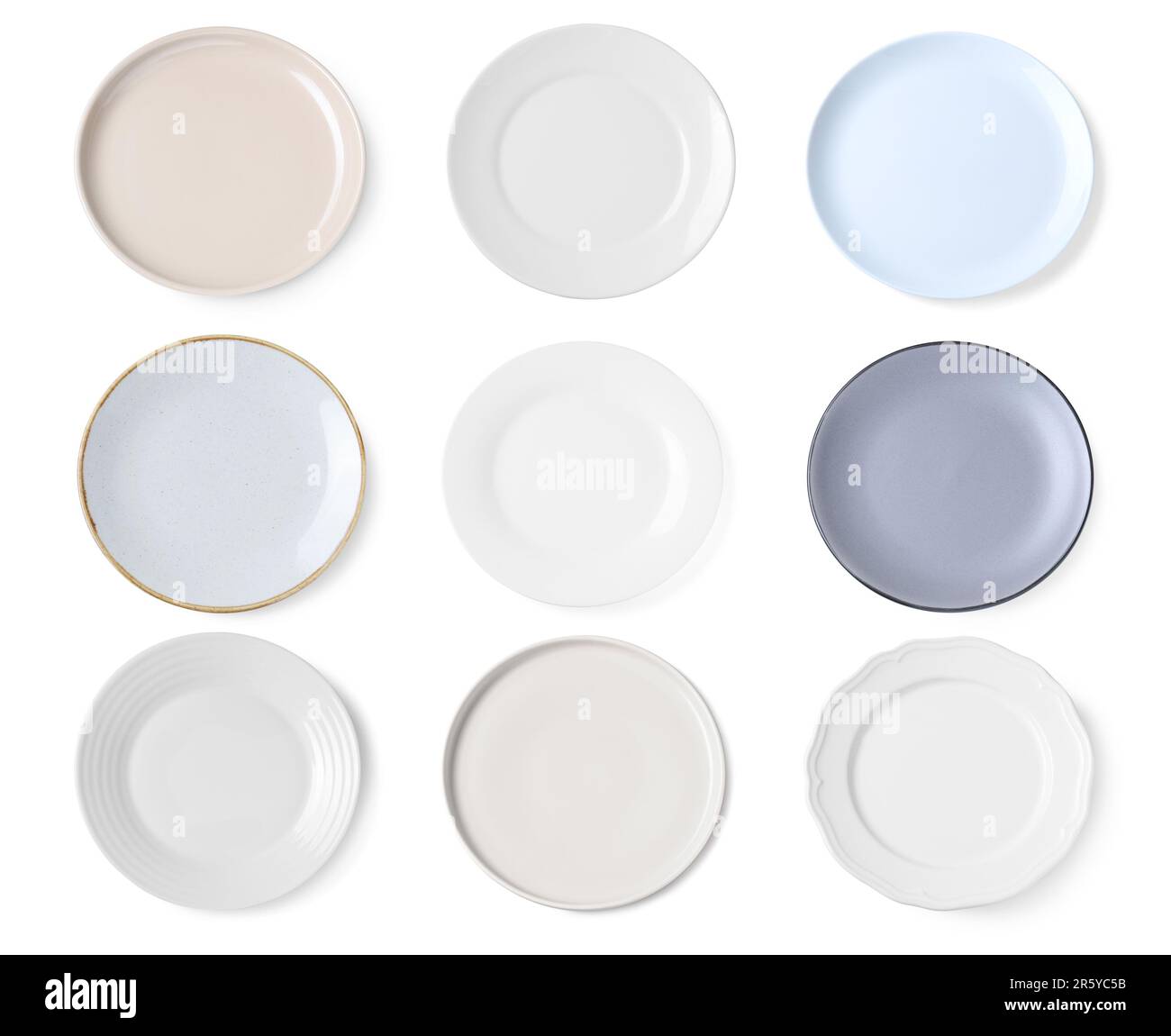Set of different ceramic plates on white background, top view Stock ...