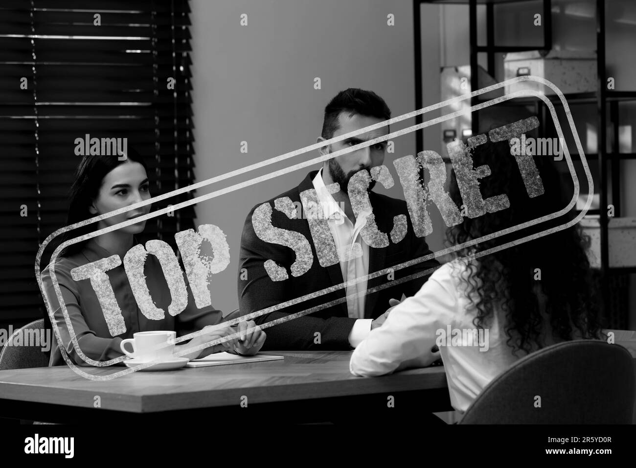 Classified information. Stamp Top Secret on black and white photo of ...