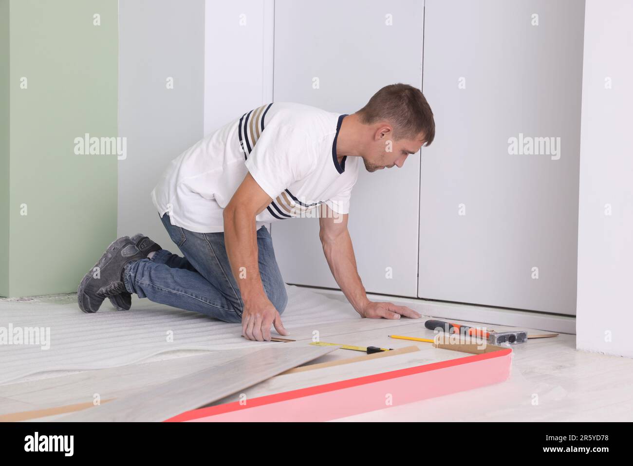 Man measuring floor in room hi-res stock photography and images - Alamy