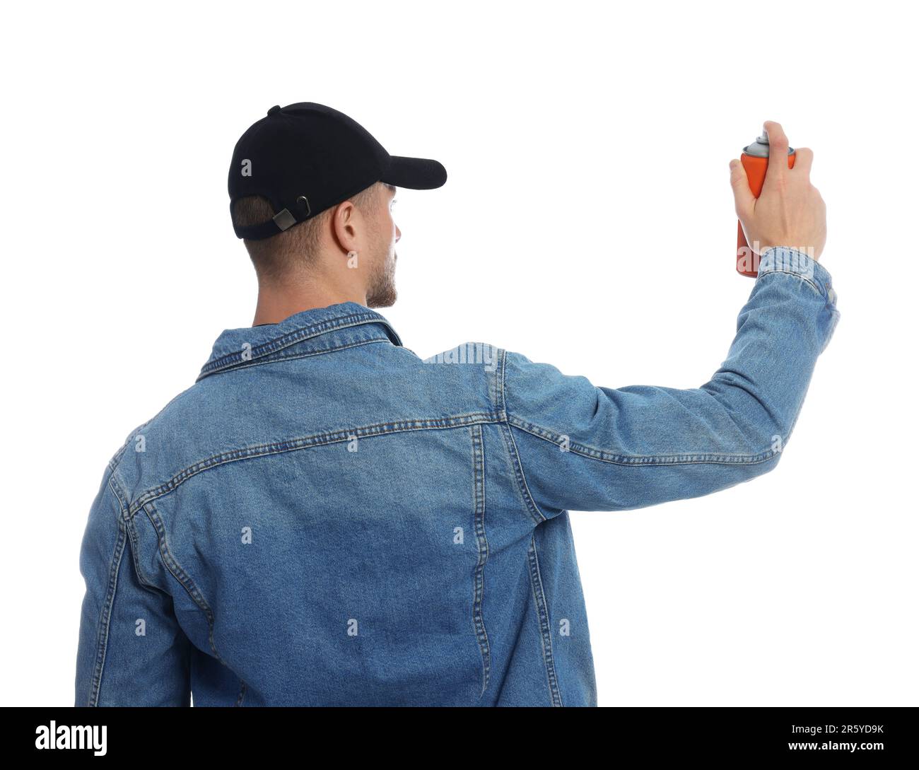 Man holding spray paint against white background, back view Stock Photo ...