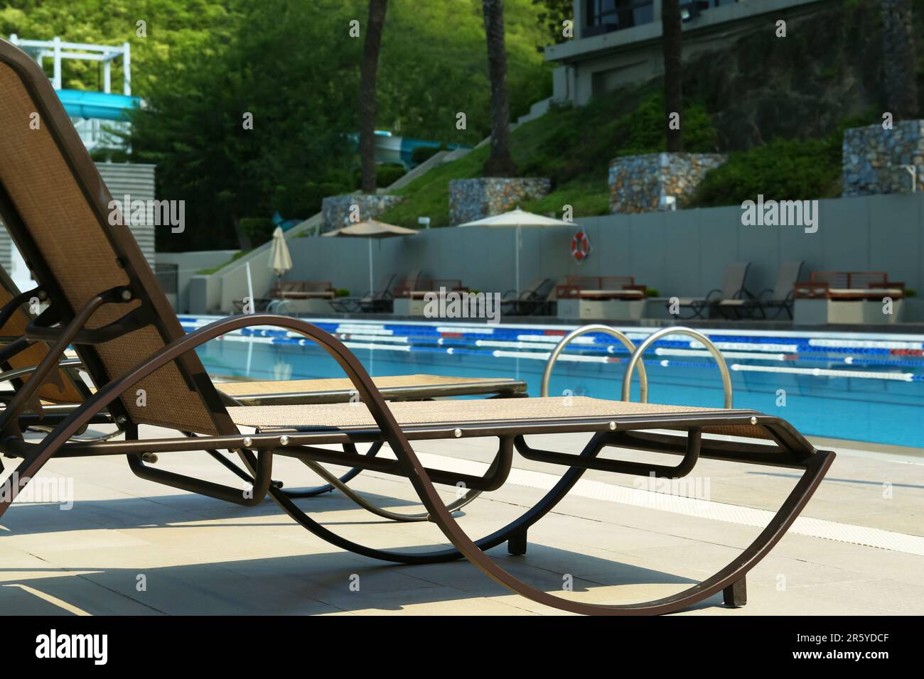 Empty sunbeds near swimming hi-res stock photography and images - Alamy