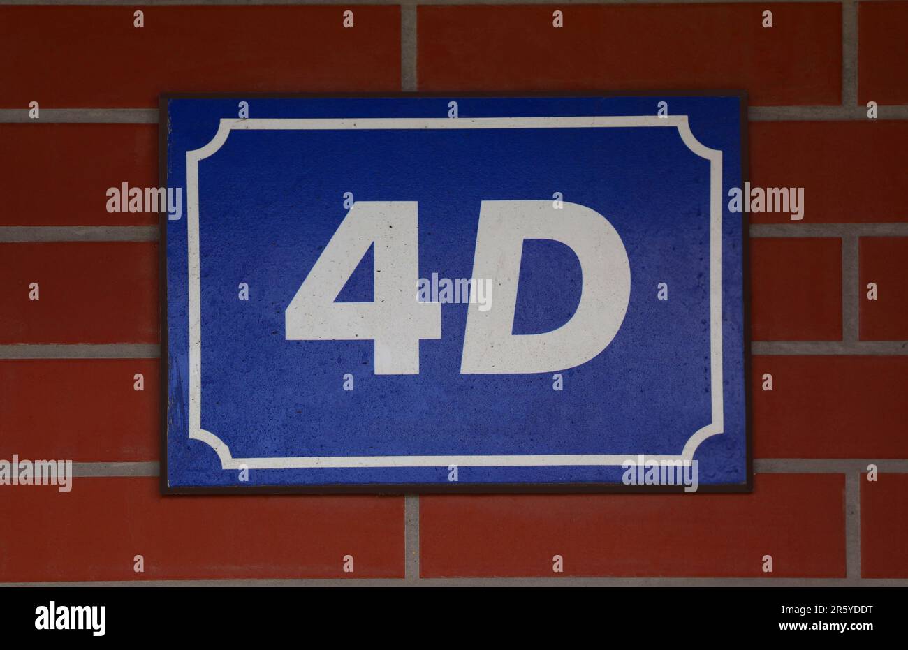 Plate with house number 4 on brick wall Stock Photo - Alamy