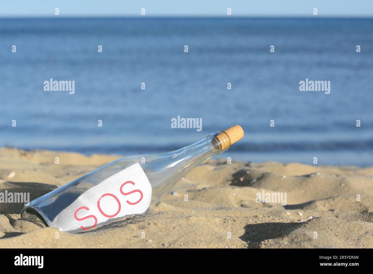 Sos message written on sand hi-res stock photography and images - Alamy
