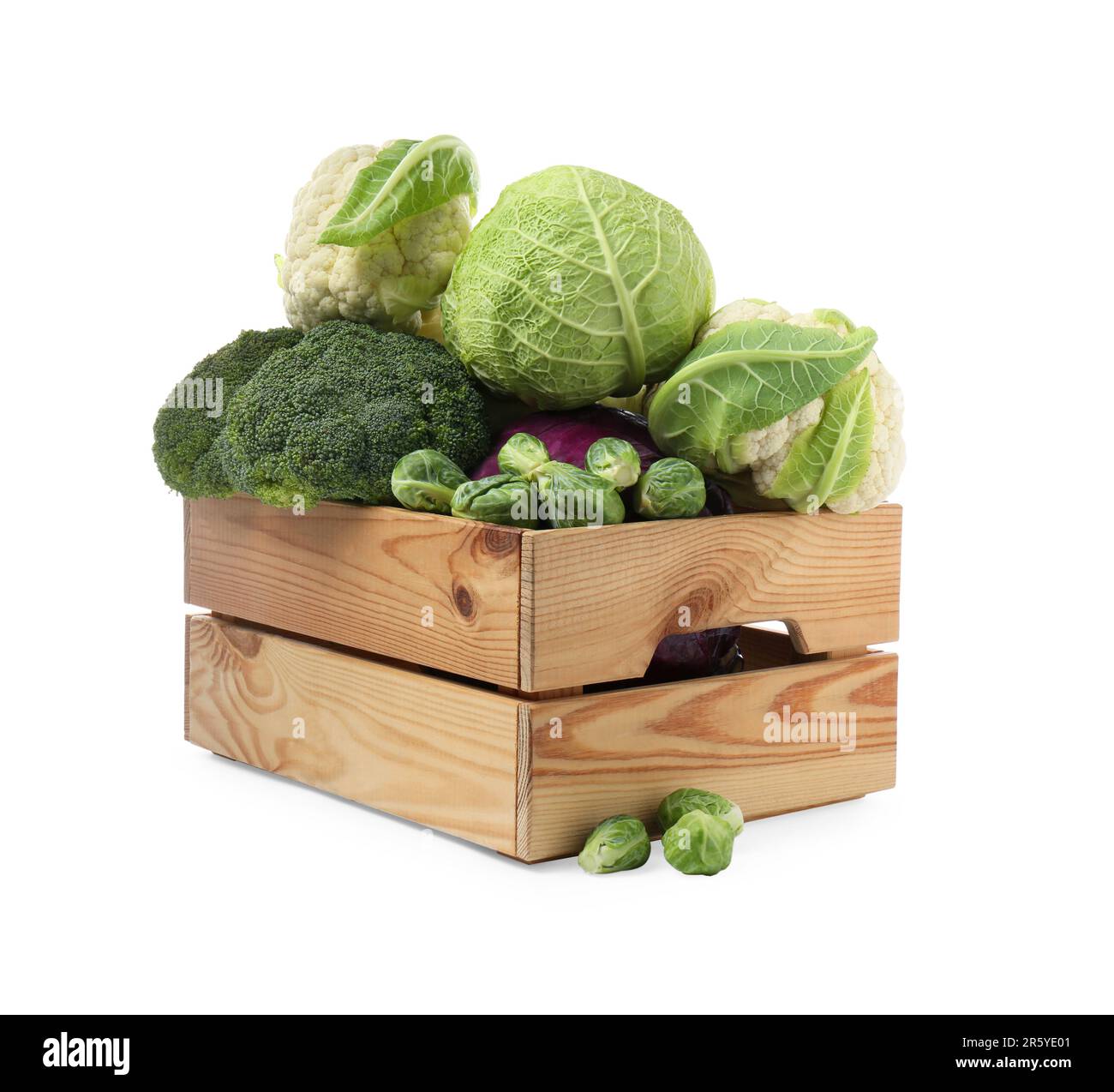 Wooden crate with different types of fresh cabbage on white background ...