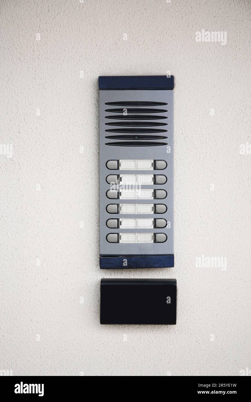 Modern intercom on beige wall. Security system Stock Photo - Alamy
