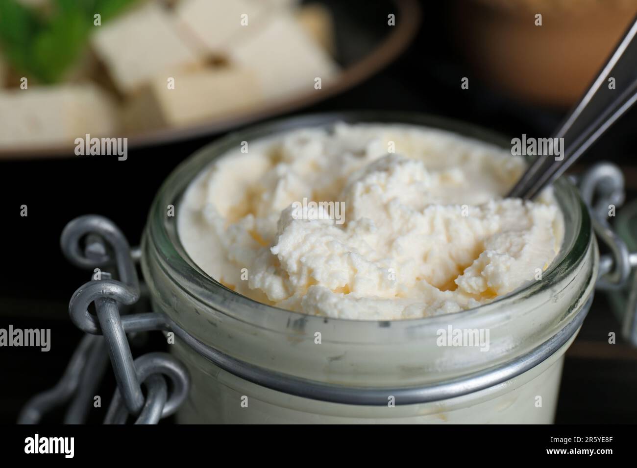 Delicious tofu cream cheese in glass jar, closeup Stock Photo - Alamy