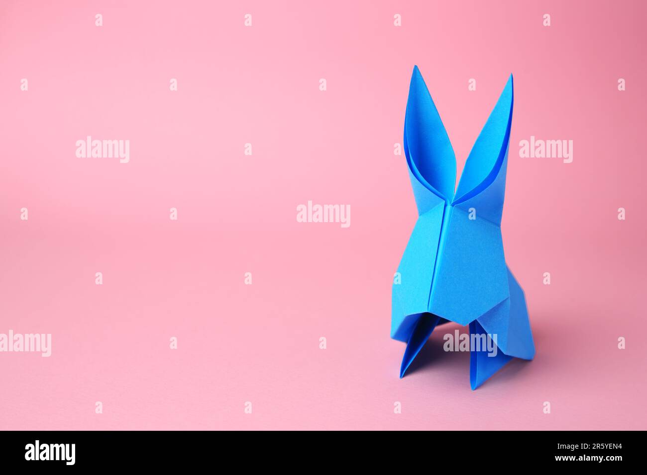 Origami art. Paper rabbit on pink background, space for text Stock ...