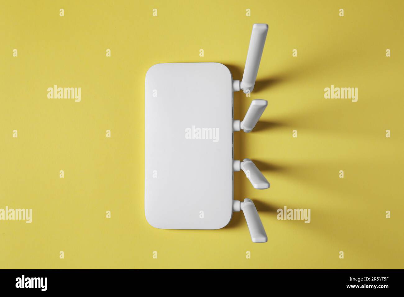 New white Wi-Fi router on yellow background, top view Stock Photo - Alamy