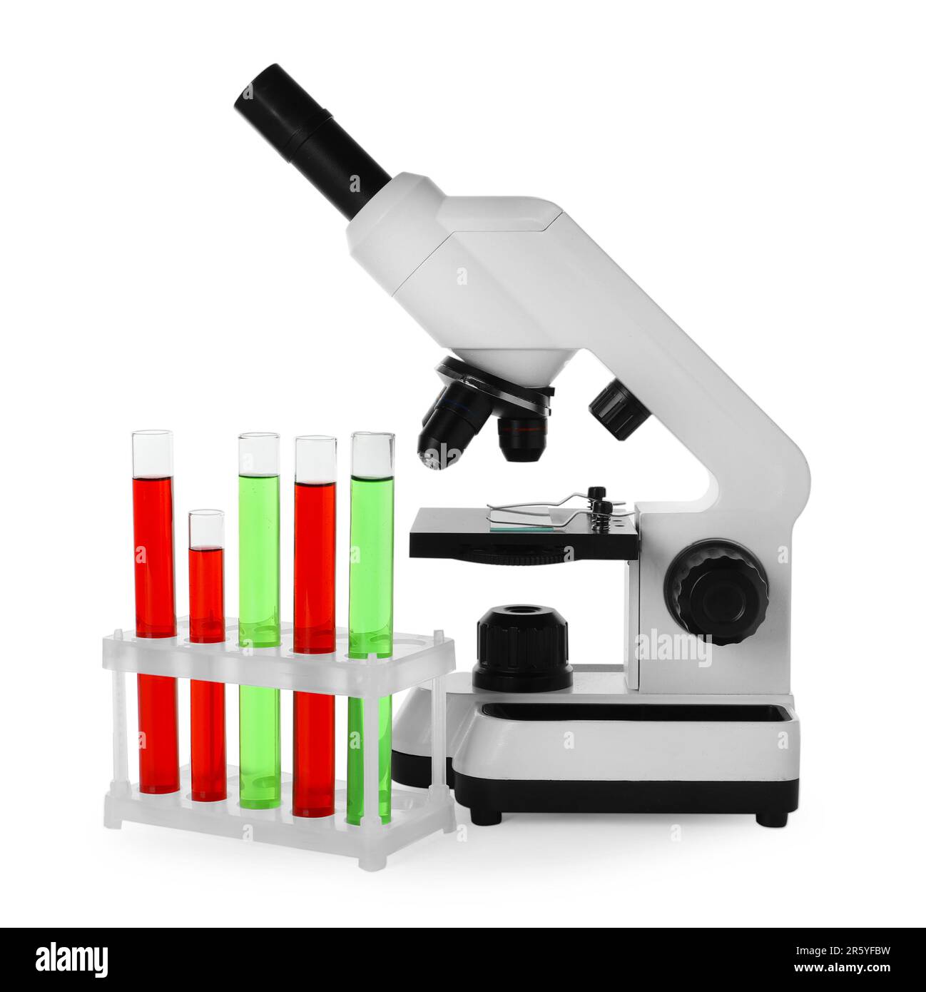 Test tubes with colorful liquids and microscope isolated on white Stock ...