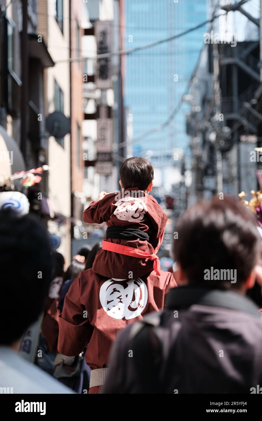 kid carried by his father on kanda matsuri festifal Stock Photo - Alamy