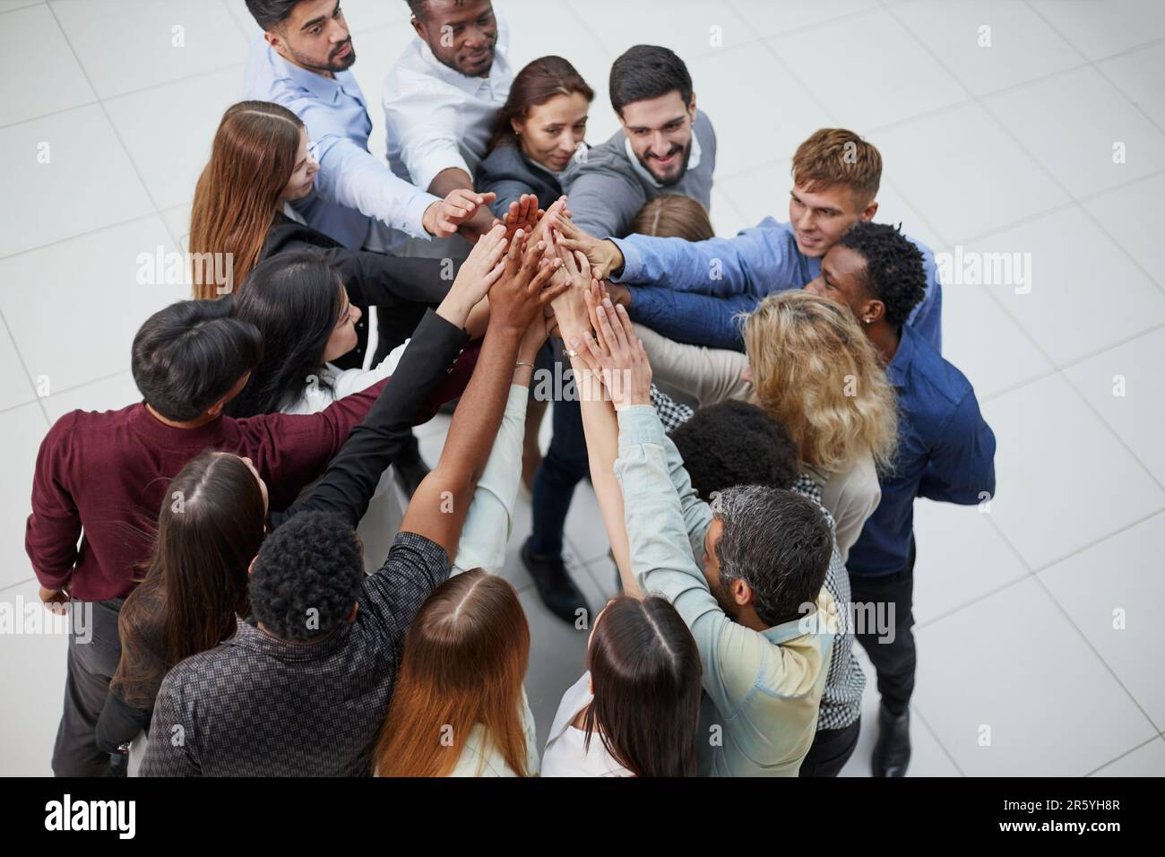 People of different ethnicities uniting to cooperate together Stock ...