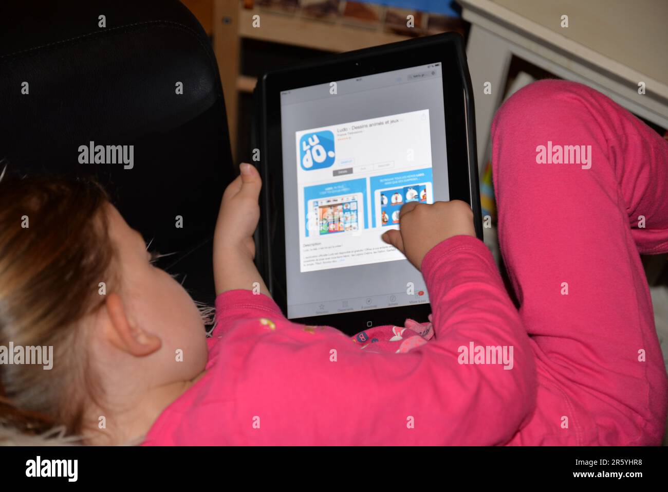 Little girl learning on her digital tablet Stock Photo - Alamy